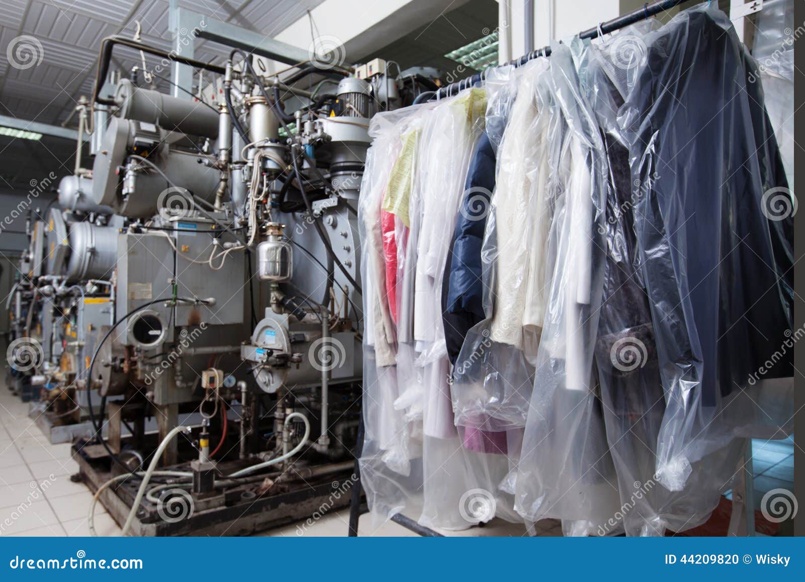 Clean Packed Clothes Hanging in Dry Cleaning Stock Photo - Image of ...