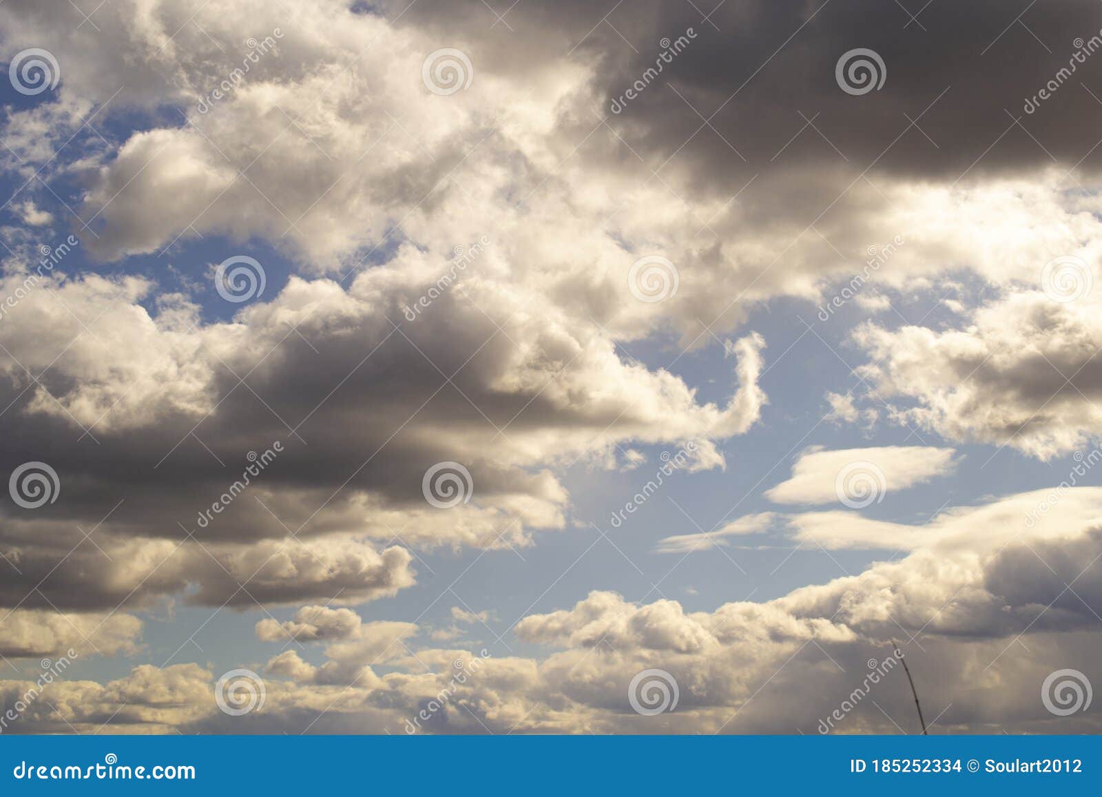 Clean Sky with Air Fluffy Clouds and Sun Behind the Cloud on Sunset As ...