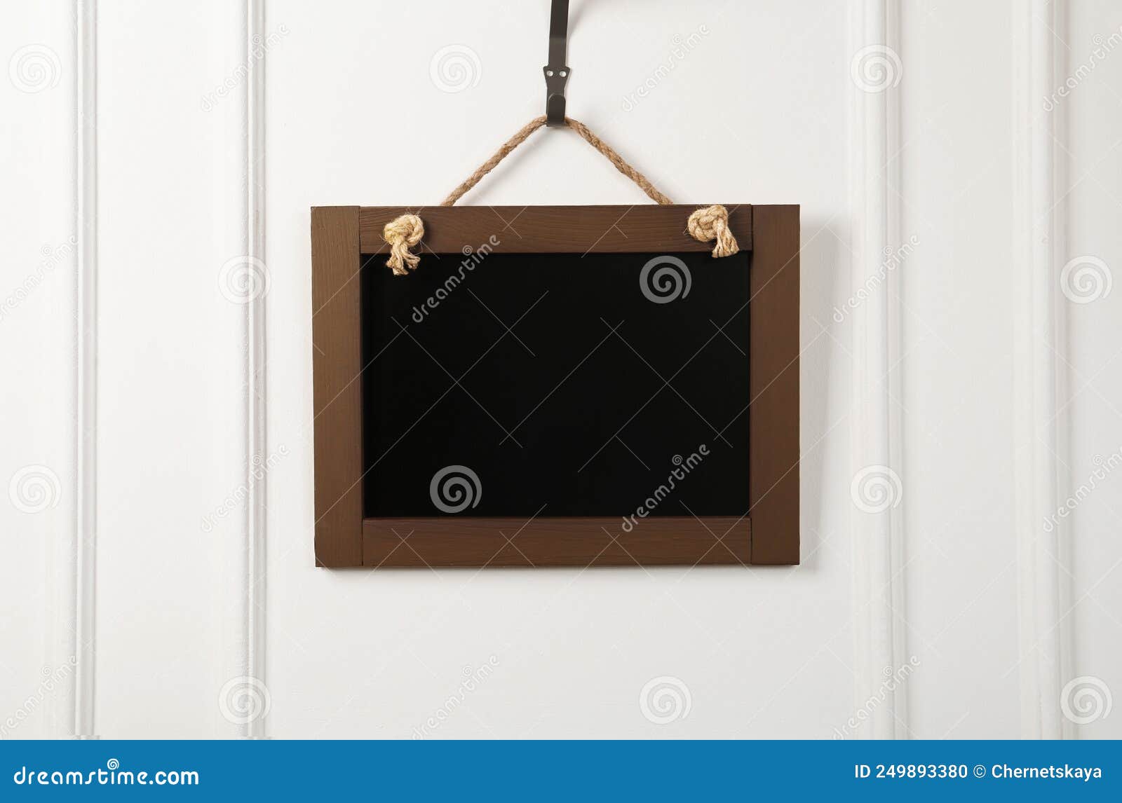 Clean Small Black Chalkboard Hanging on White Wall Stock Photo - Image ...
