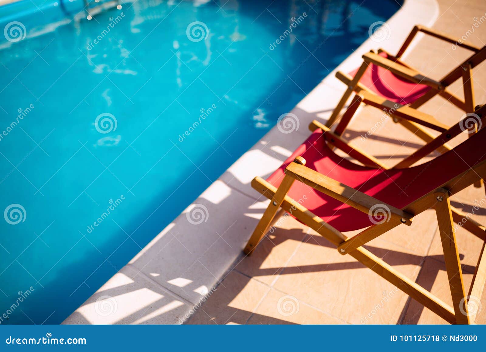 Clean Swimming Pool with Sunbathing Chairs Stock Photo - Image of ...