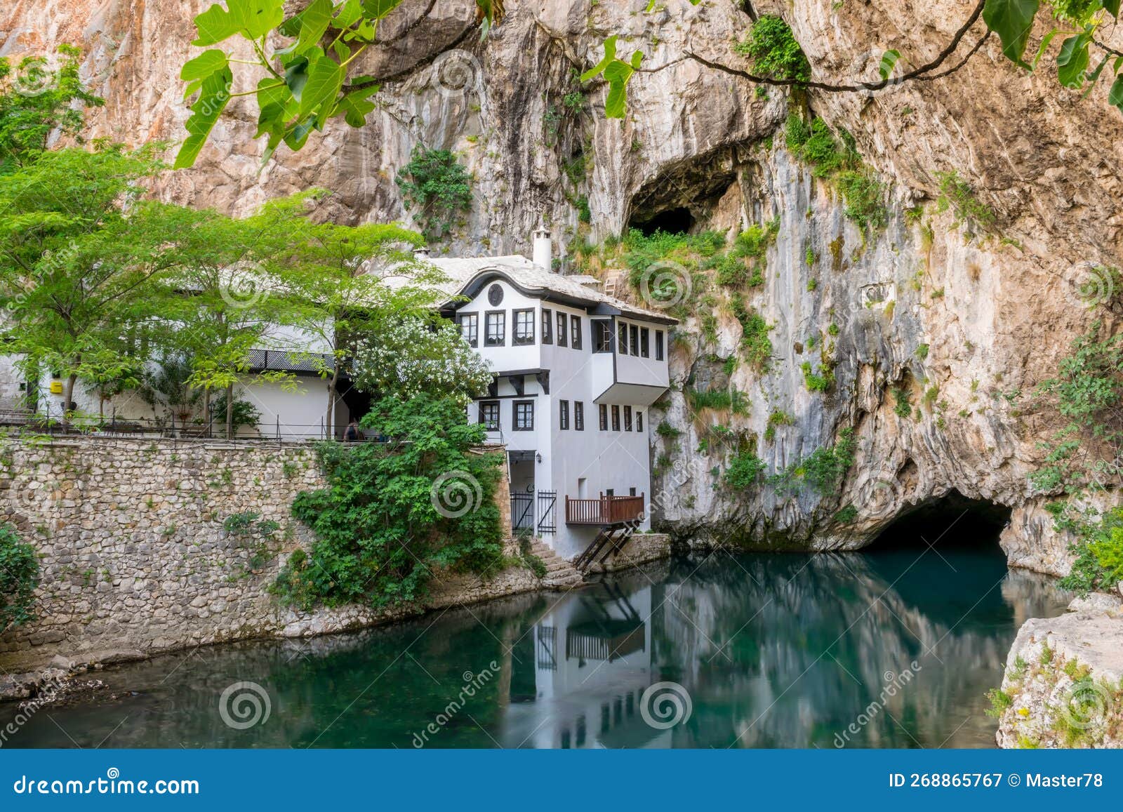 A Clean Underground River Emerges From A Cave Near An Mosque Stock ...