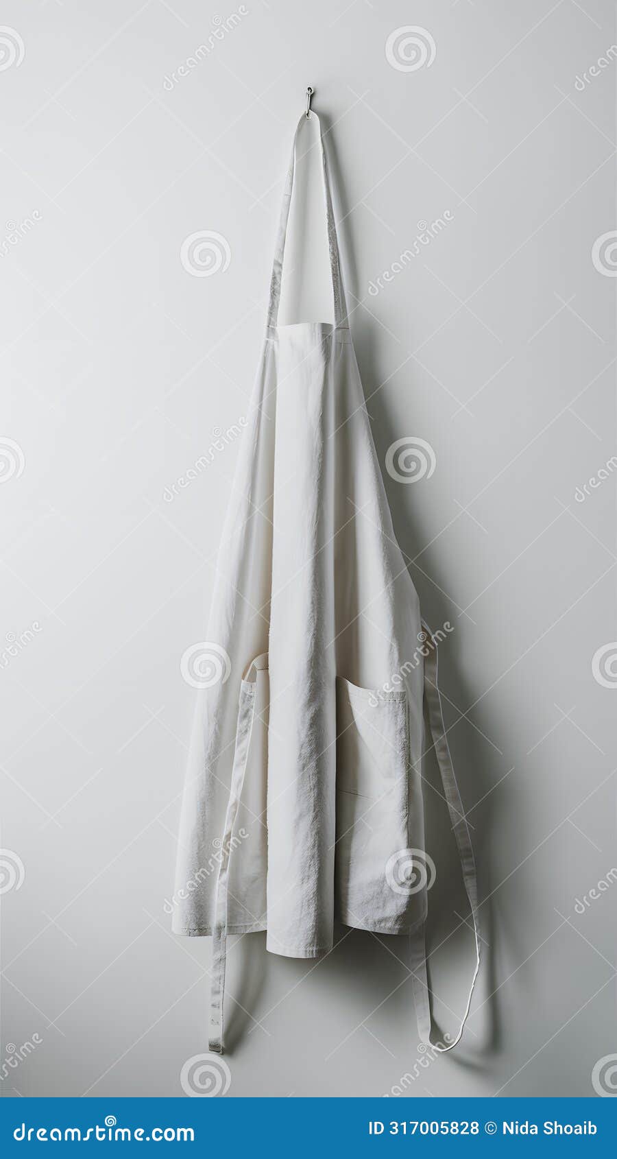 Clean White Apron Hanging Neatly, Symbolizing Simplicity and ...