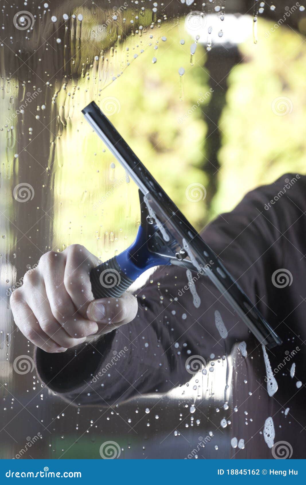 Clean window with squeegee stock photo. Image of housework - 18845162