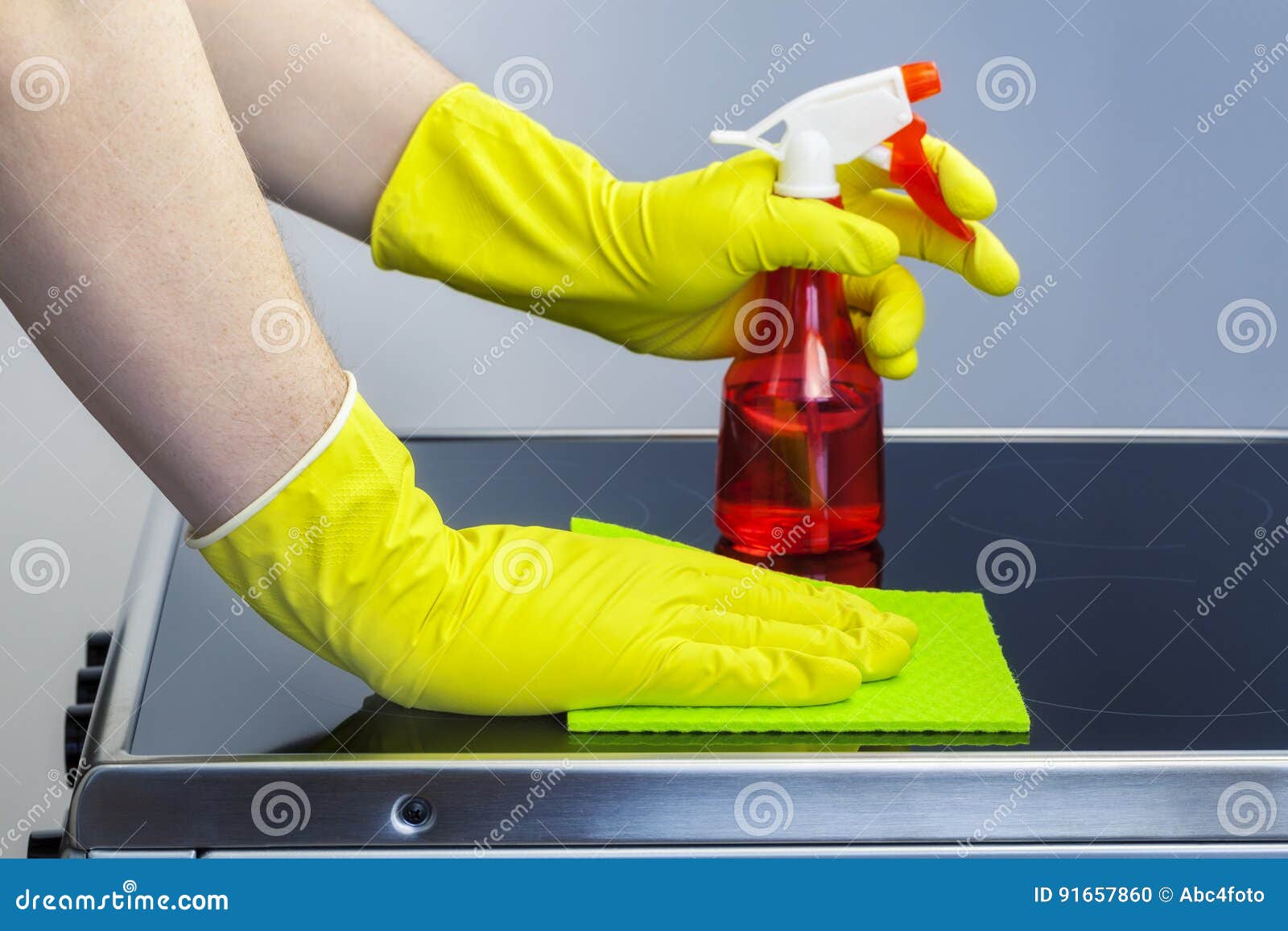 Cleaner Cleaning Surface of Electric Cooker Stock Photo - Image of ...