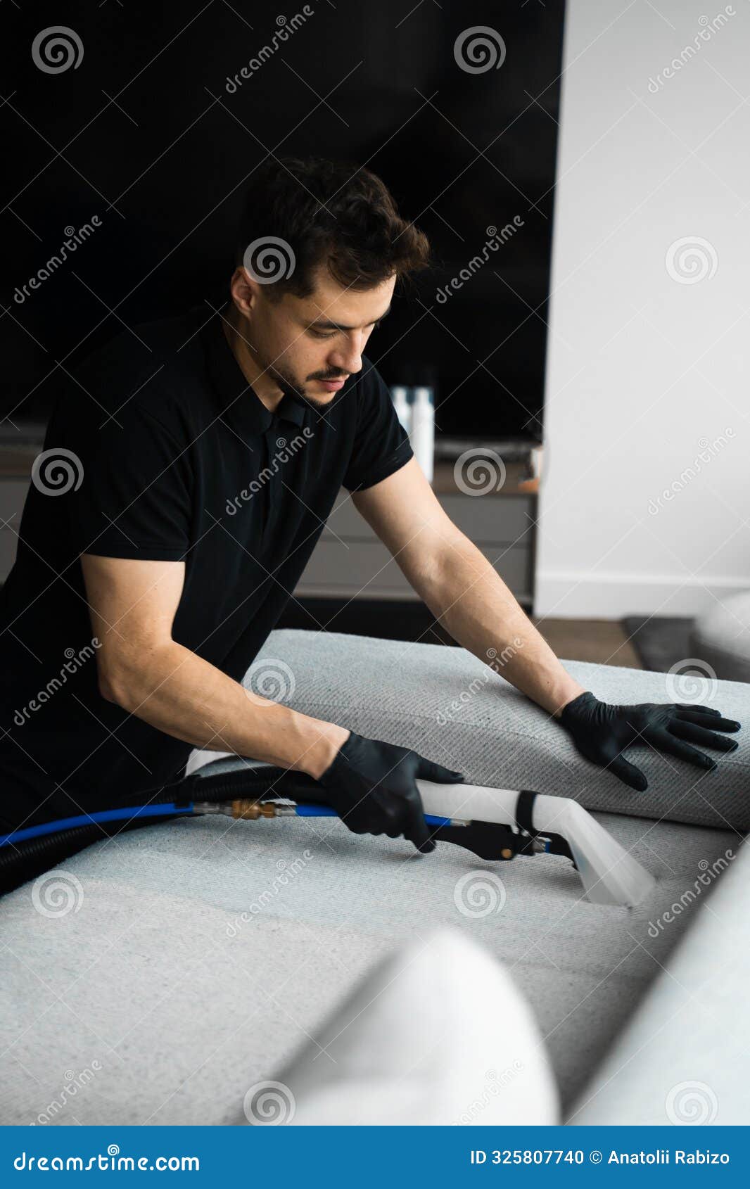 Cleaner is Dry-cleaning Sofa Using Extractor Machine with Detergent ...