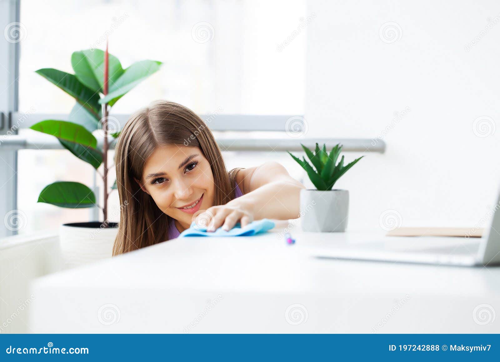 Cleaner Tidies Up the Computer Desk in the Office. Stock Photo - Image ...