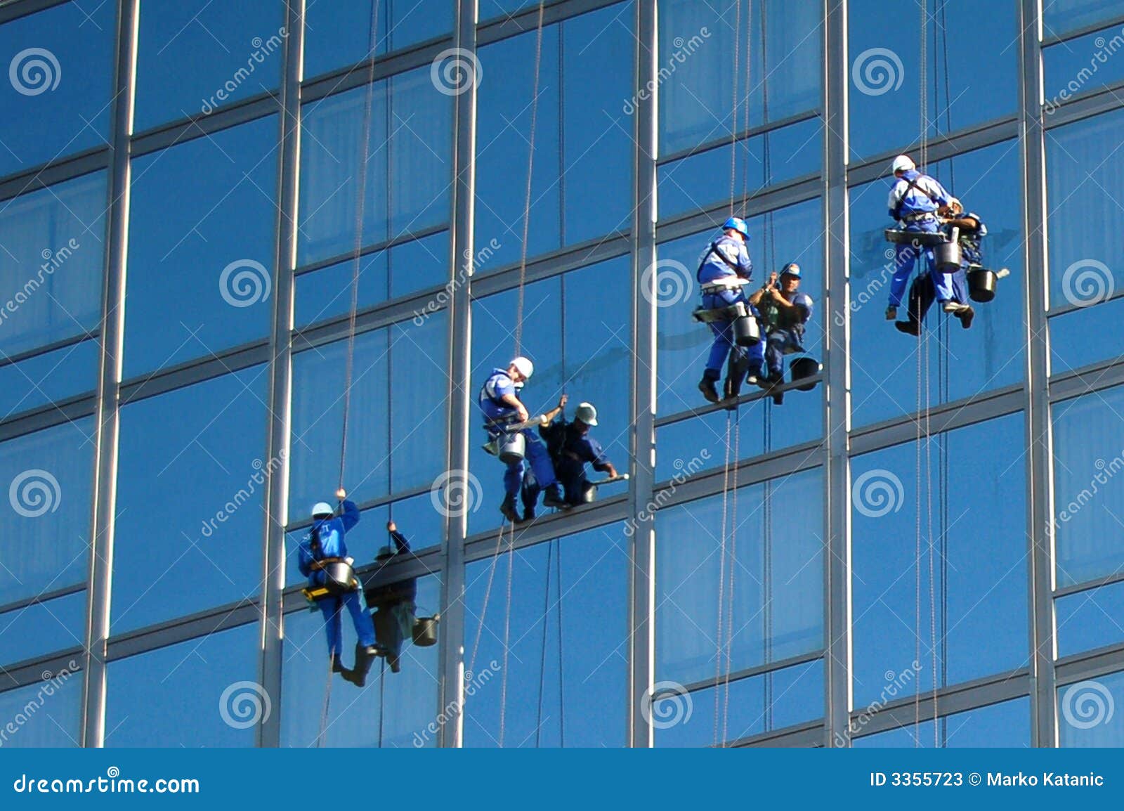 Cleaners on the building 2 stock image. Image of uniform - 3355723