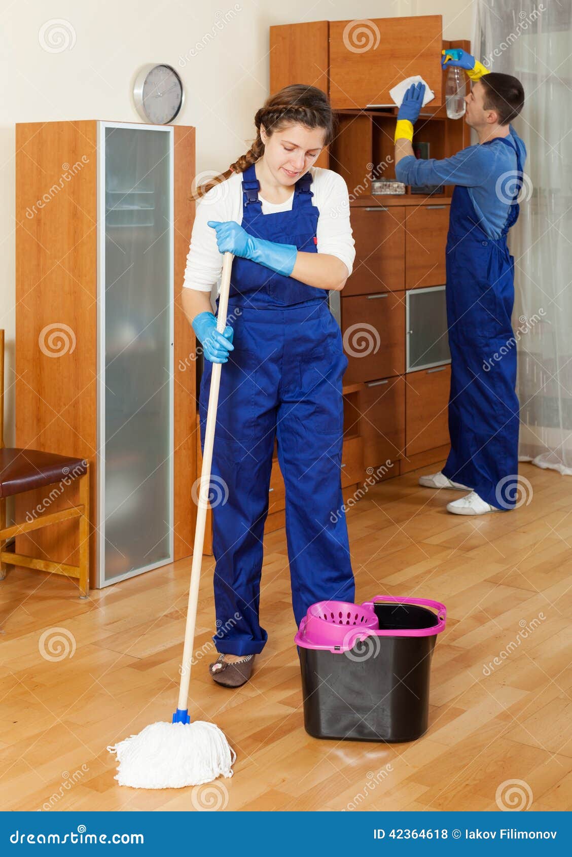 Cleaners cleaning in room stock photo. Image of adult - 42364618