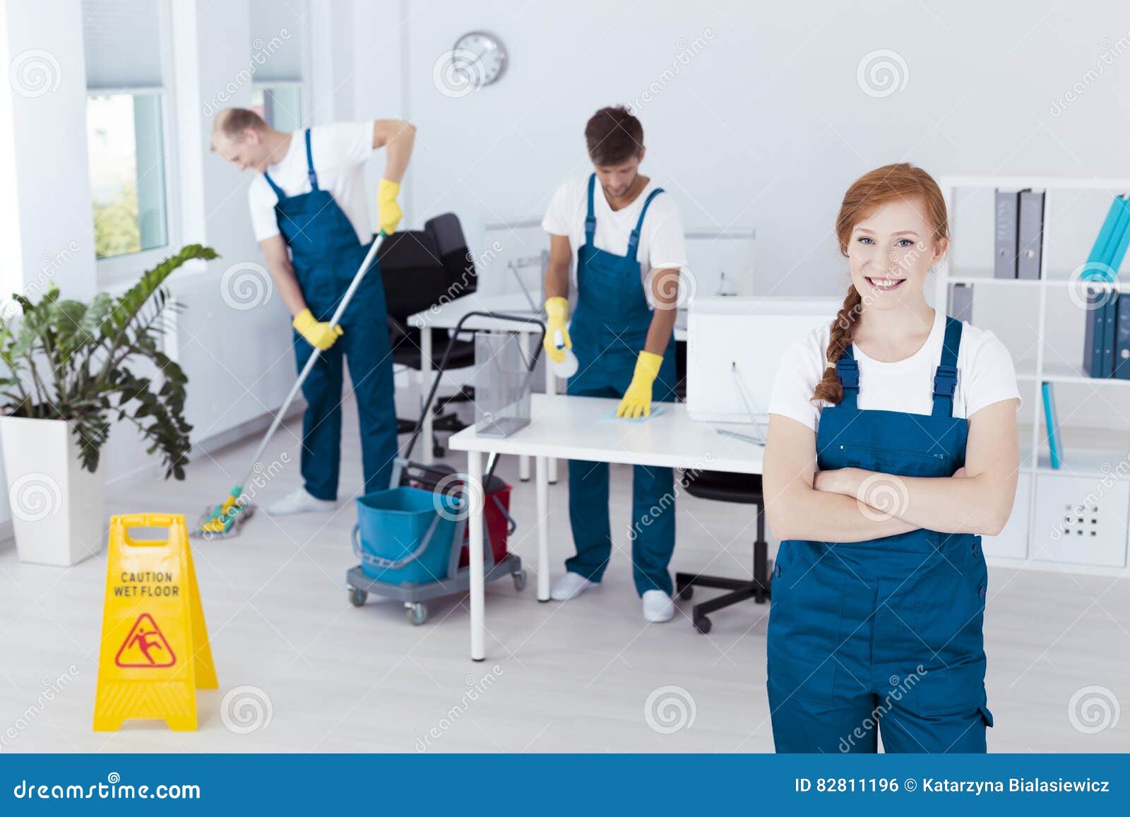 Cleaners working in office stock photo. Image of bussiness - 82811196