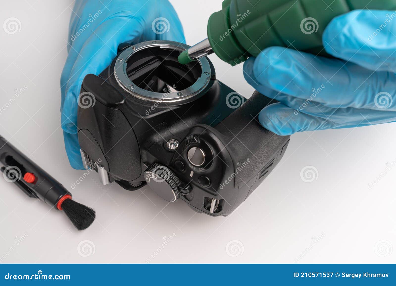 Cleaning the Camera Matrix, Blowing Off the Sensor with a Green Blower ...