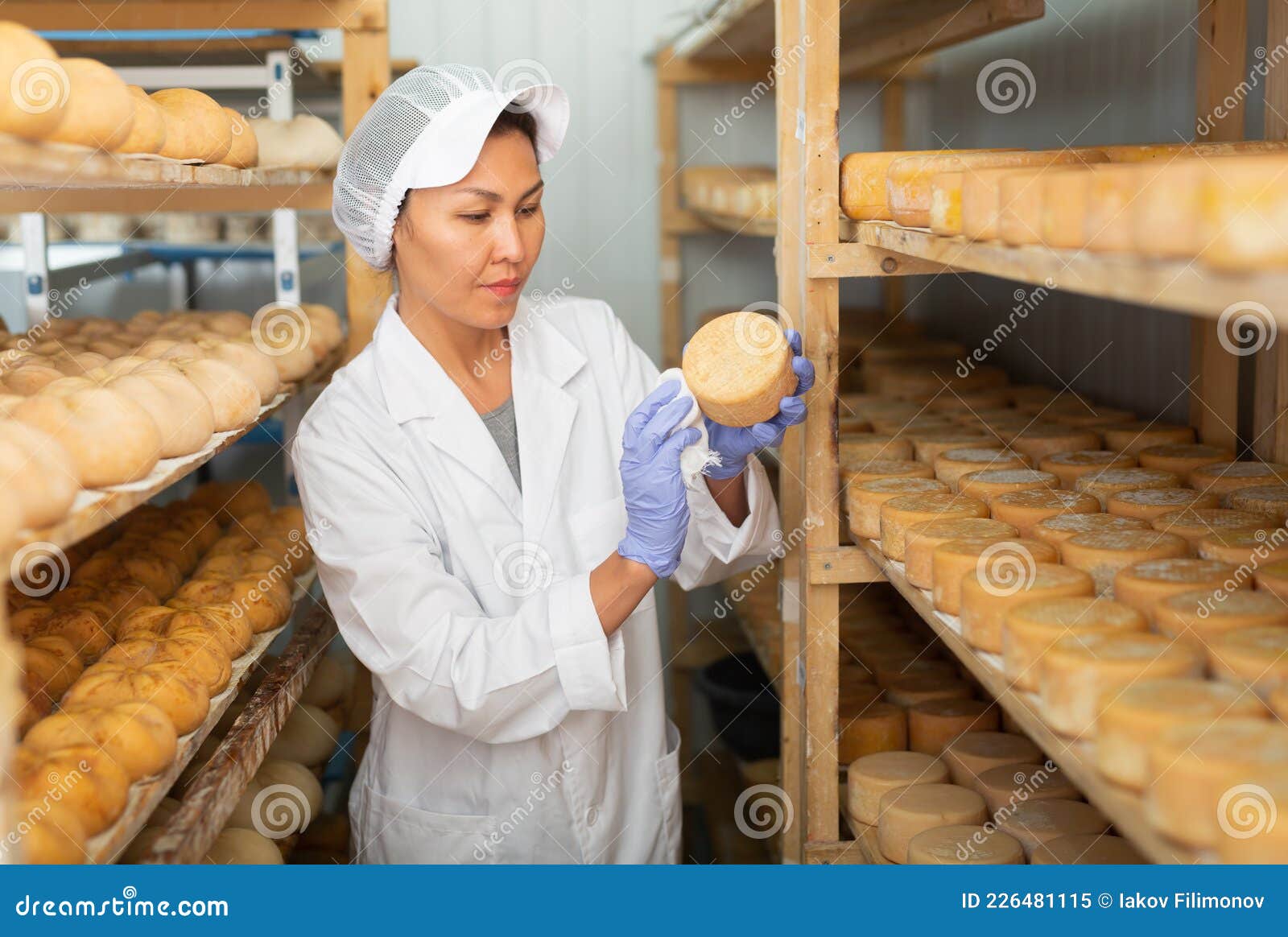 Cleaning Cheese while it Matures at Cheese Factory Stock Image - Image ...