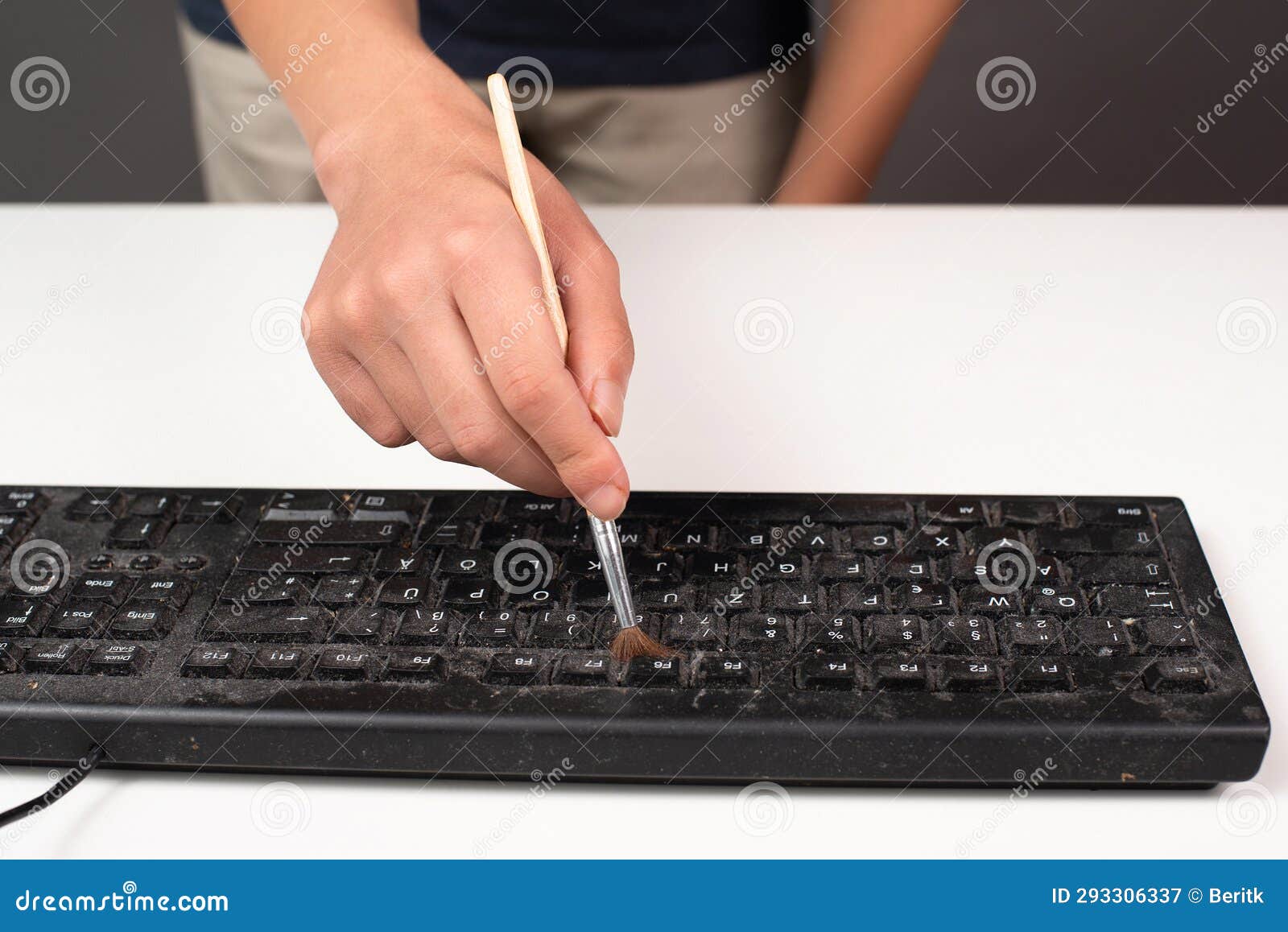 Cleaning Computer Keyboard in Office with Rubber Protective Glove and a ...