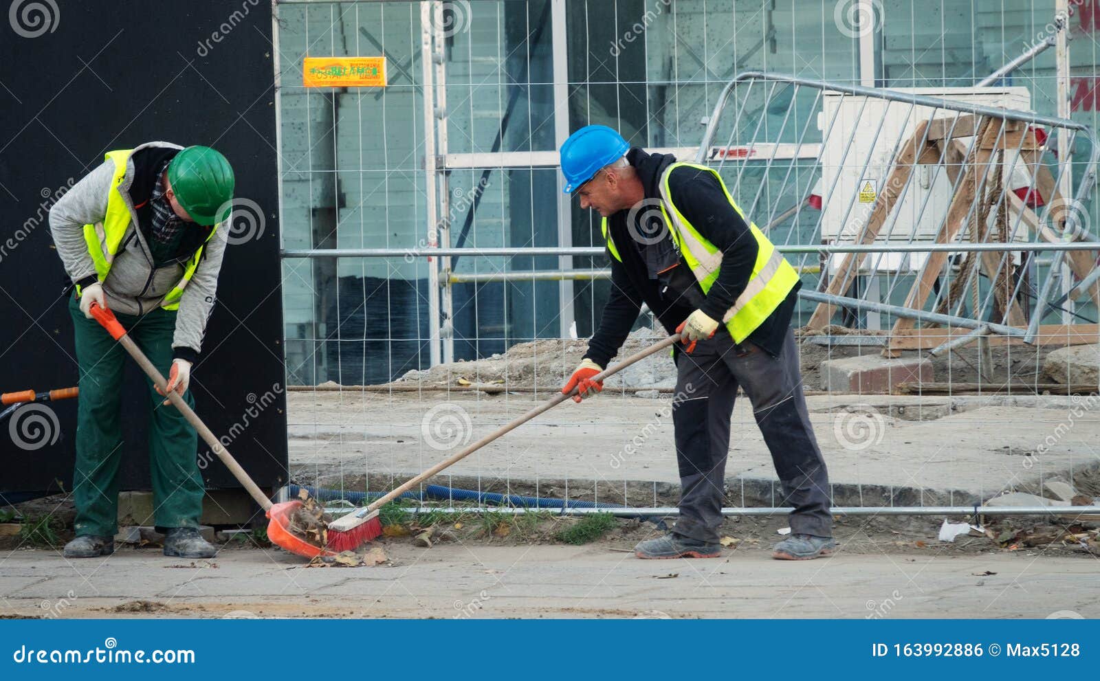 Cleaning Debris Workers in Helmets on Construction Site Editorial Photo ...