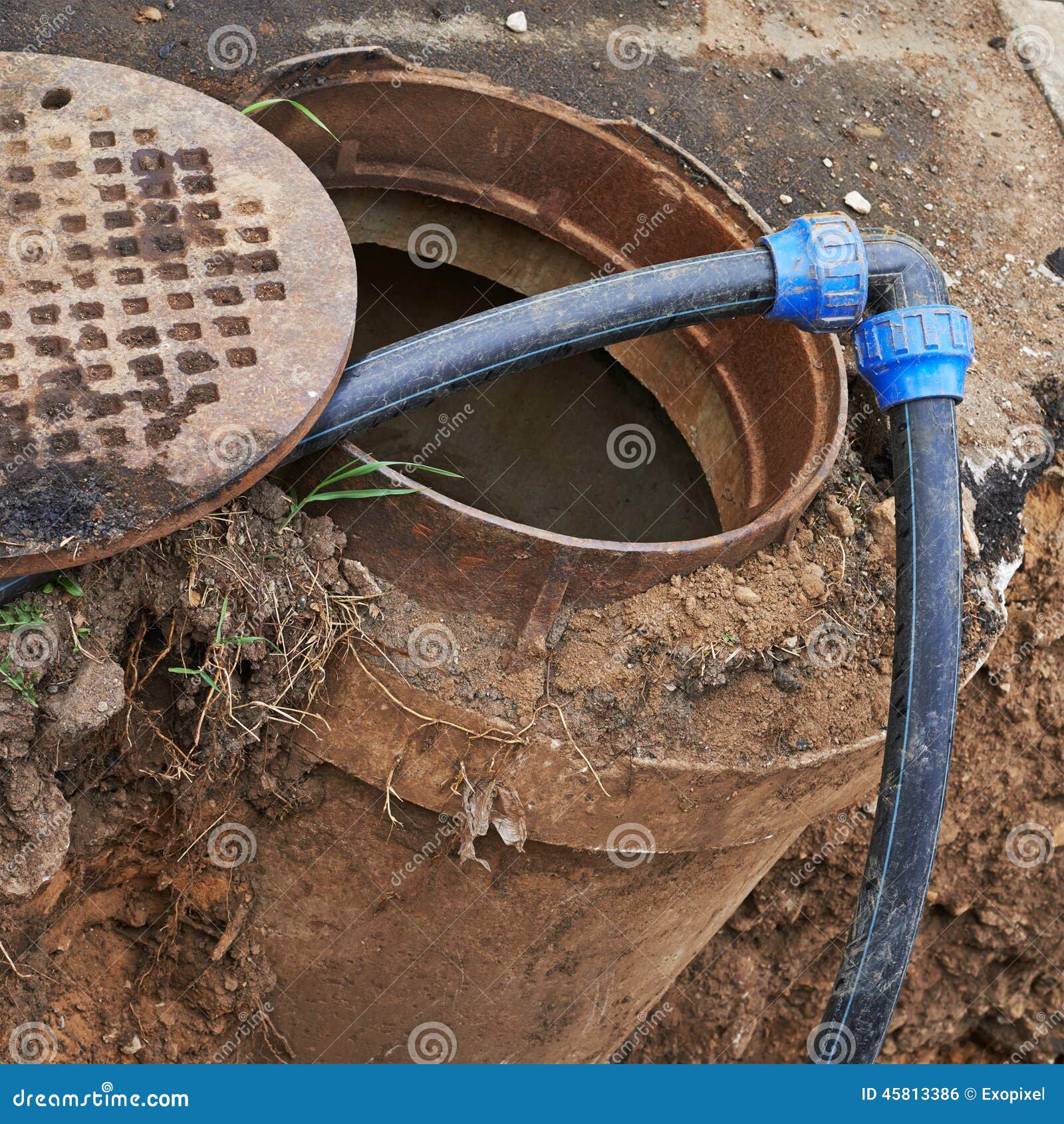 Cleaning Equipment in a Sewer Manhole Stock Photo - Image of ground ...