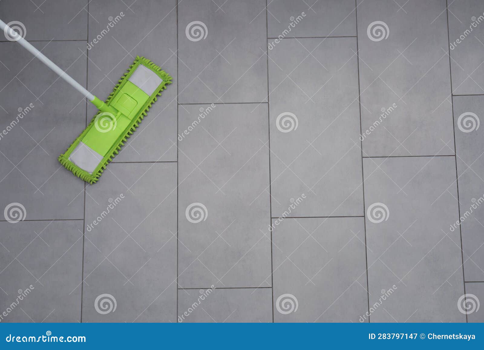 Cleaning Grey Tiled Floor with Microfiber Mop, Top View. Space for Text ...