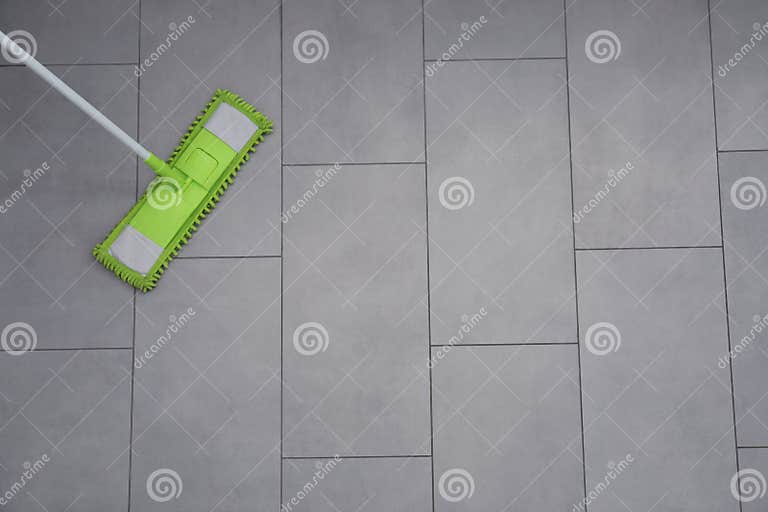 Cleaning Grey Tiled Floor with Microfiber Mop, Top View. Space for Text ...