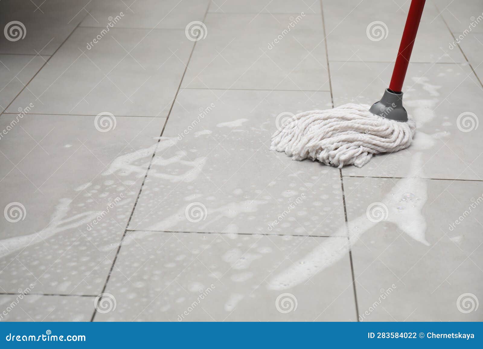 Cleaning Grey Tiled Floor with String Mop, Space for Text Stock Photo ...