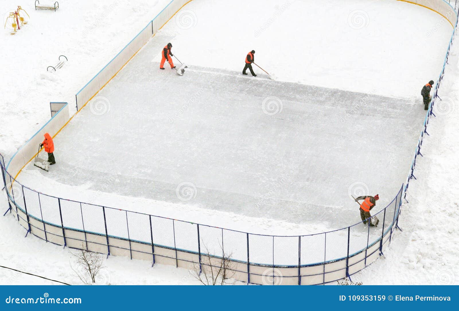 Cleaning of the Ice Rink from the Snow in the Yard of the House Stock ...