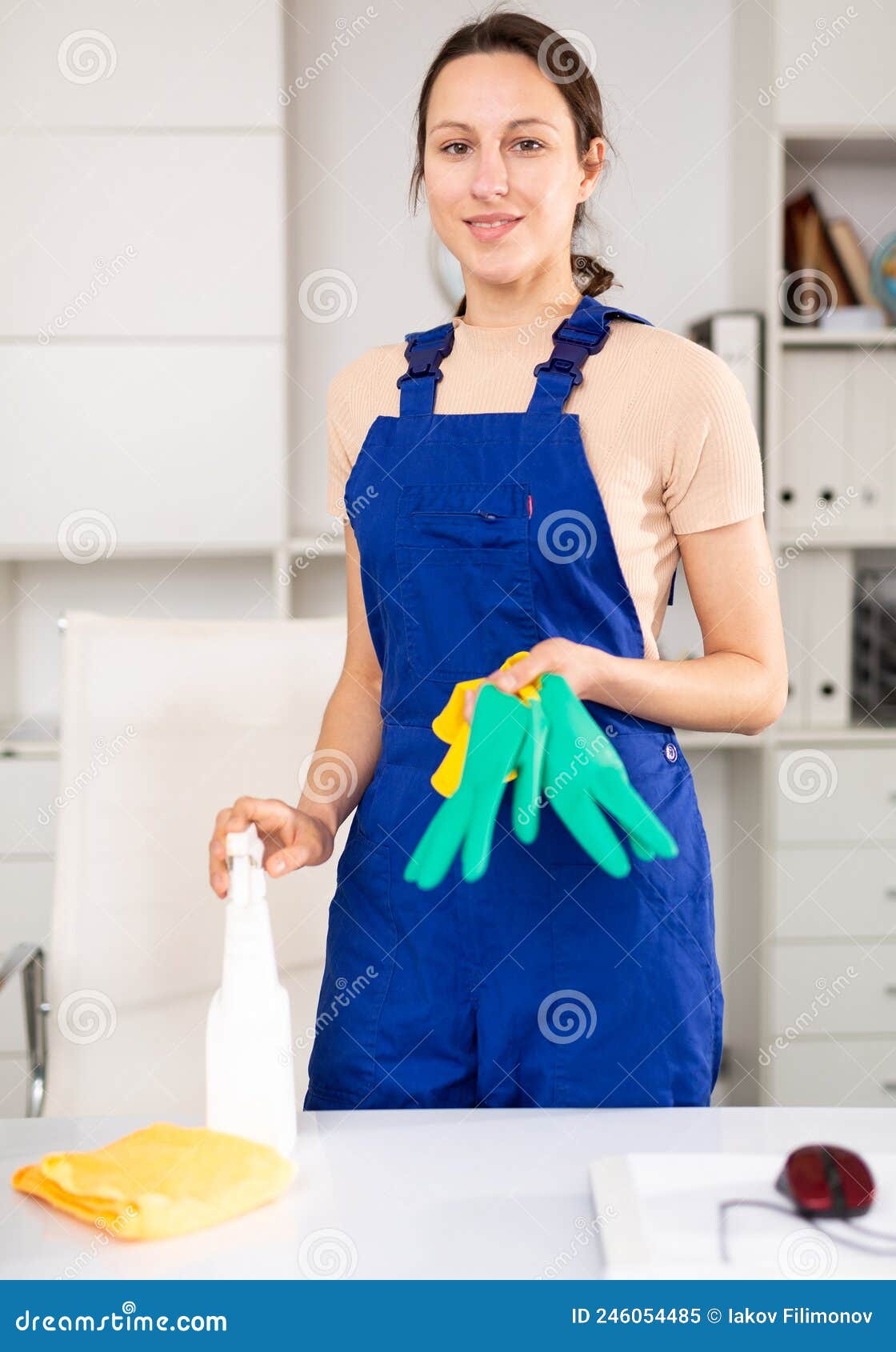 Cleaning Lady in Overalls Wipes Dust from Table in Office Stock Image ...