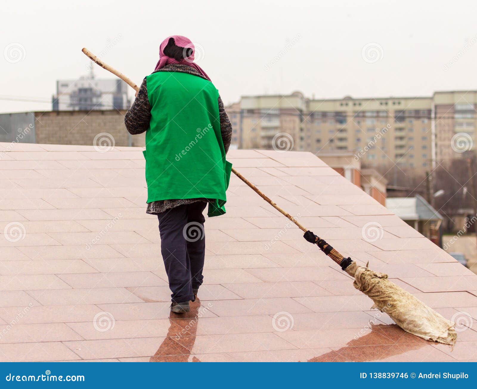 A Cleaning Lady is Sweeping the Road with a Broom Stock Photo - Image ...