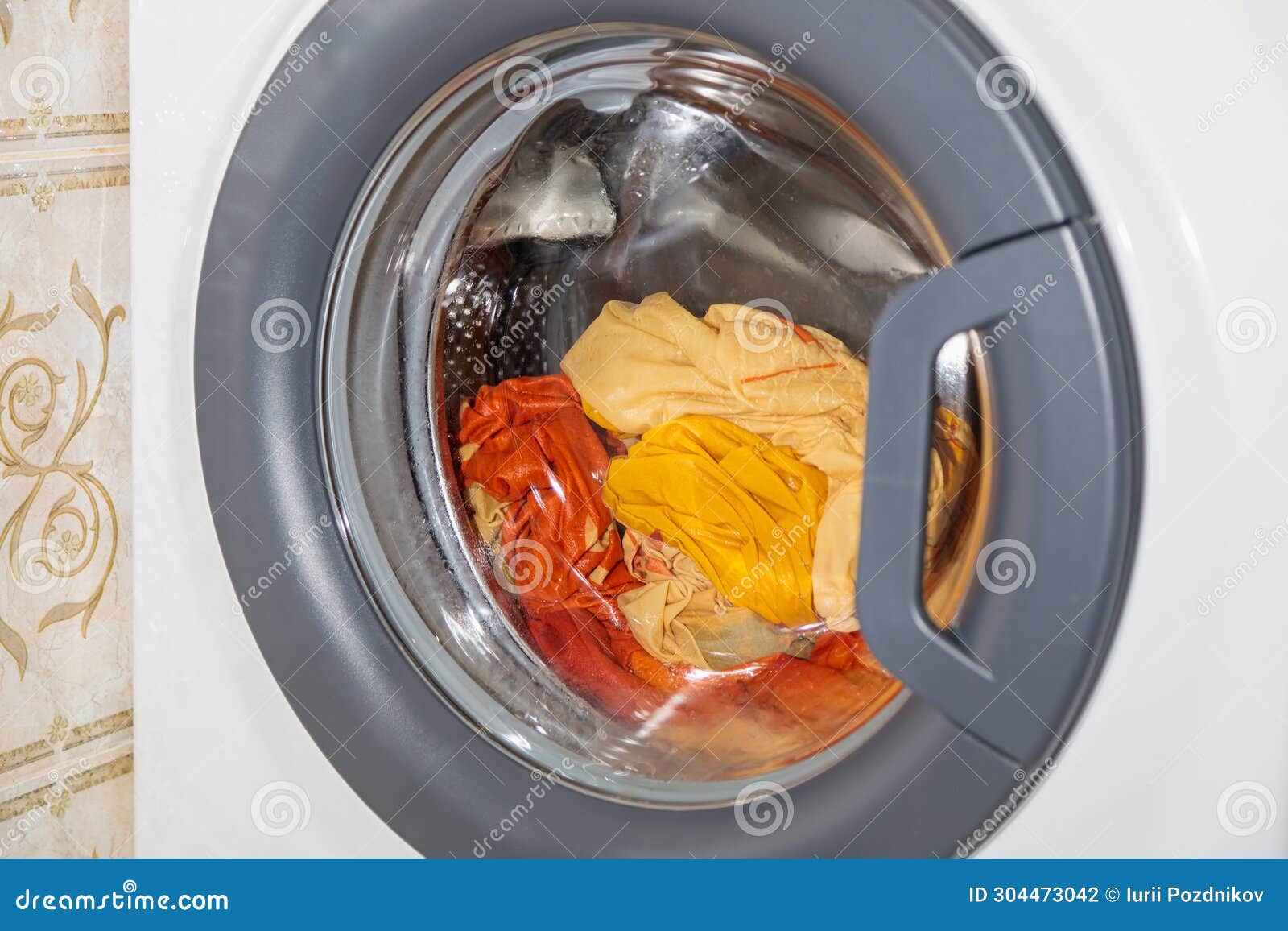 Efficient Washing of Various Fabrics in the Washing Machine Stock Photo ...