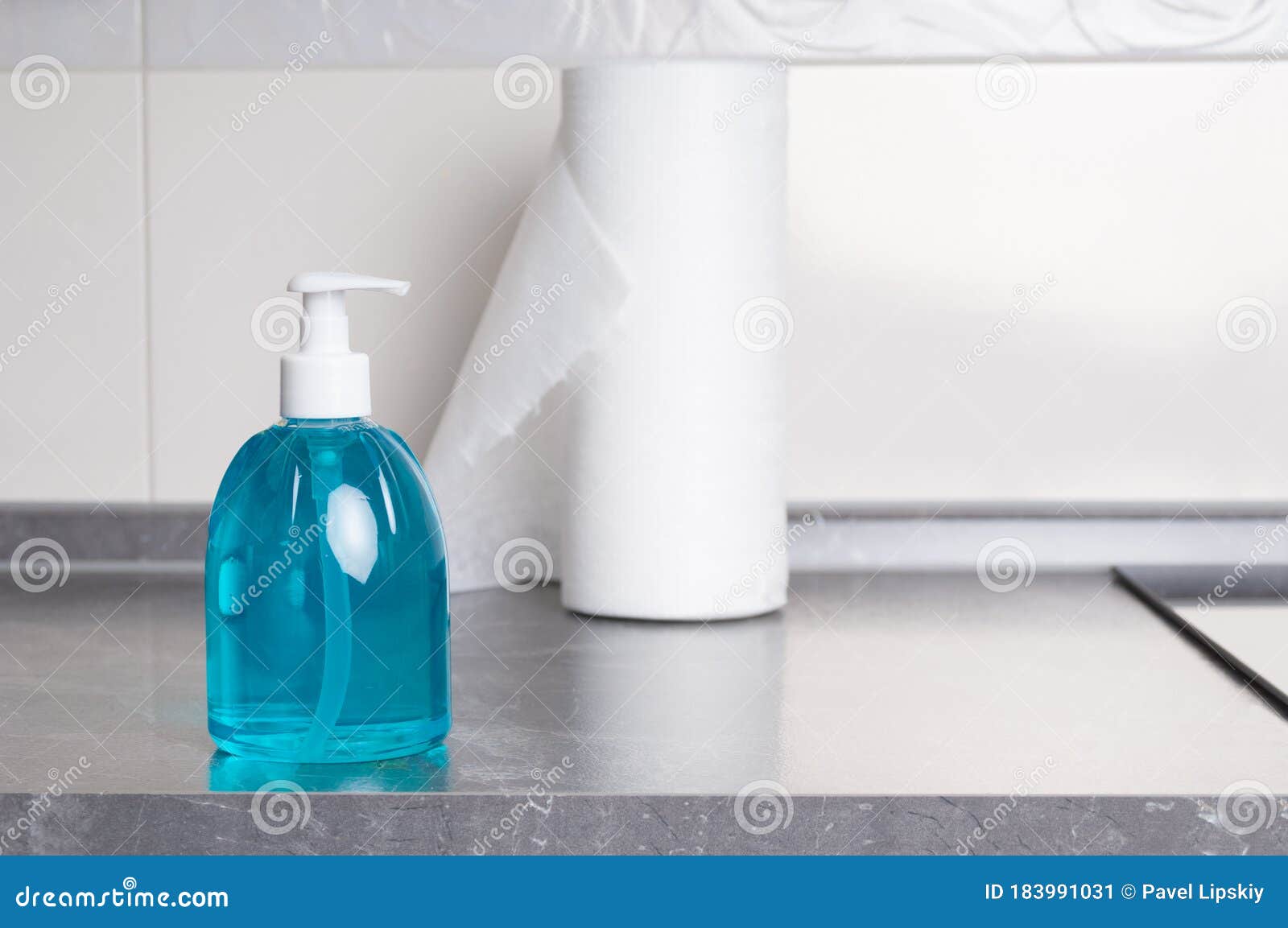 Cleaning Liquid and Paper Towel on Kitchen Table. Front Focus Stock ...