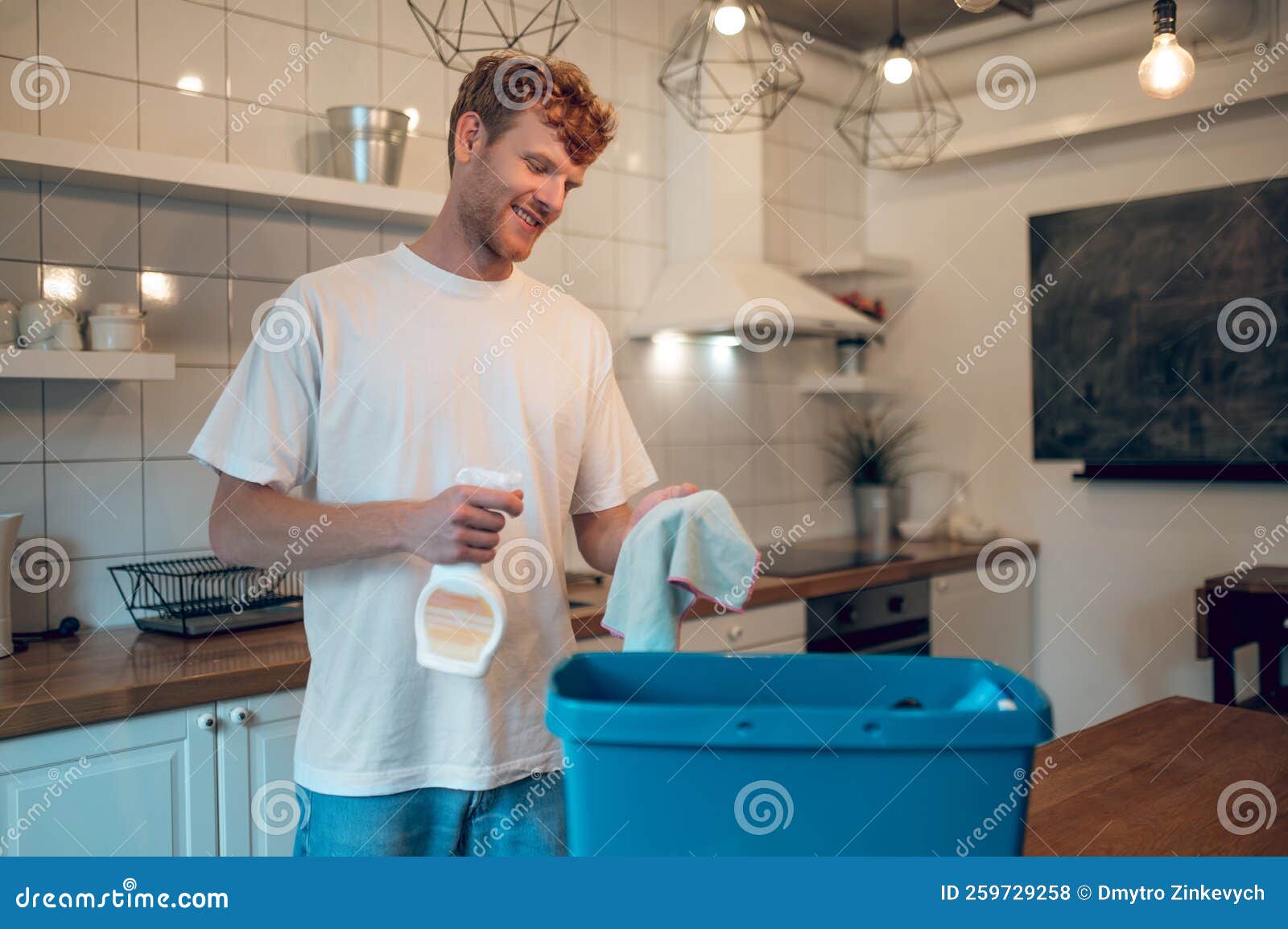 Man Doing Some Housework and Cleaning Some Surfaces Stock Photo - Image ...