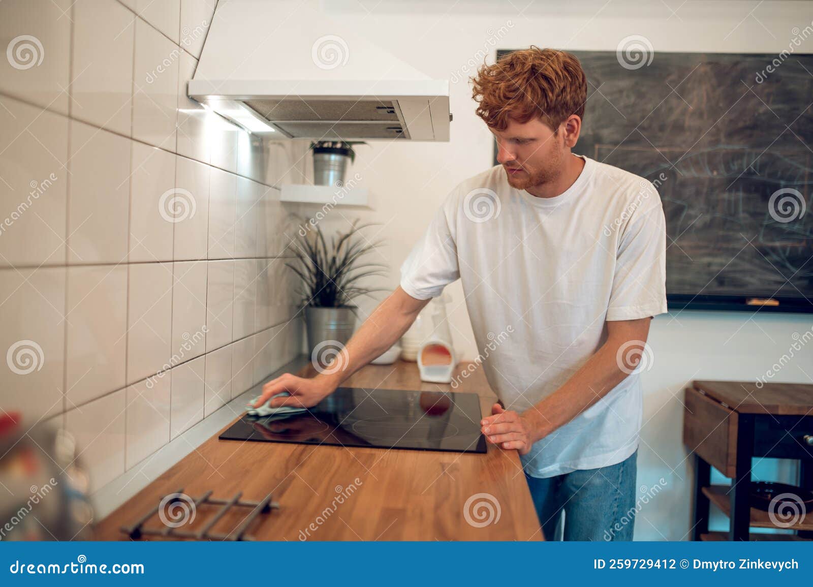 Man Doing Some Housework and Cleaning Some Surfaces Stock Photo - Image ...