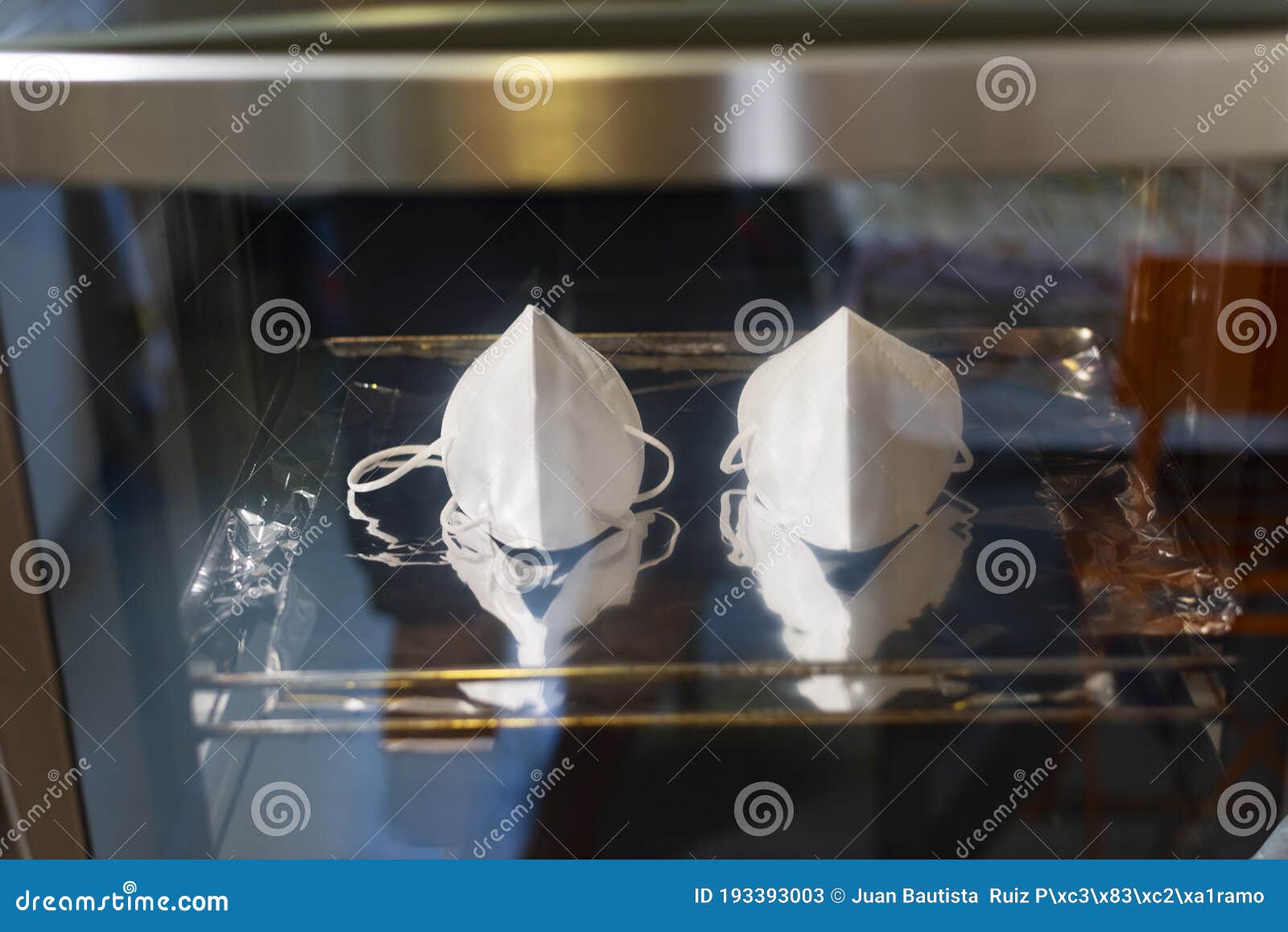 Cleaning of the Mask by Heat in a Conventional Oven Stock Image - Image ...
