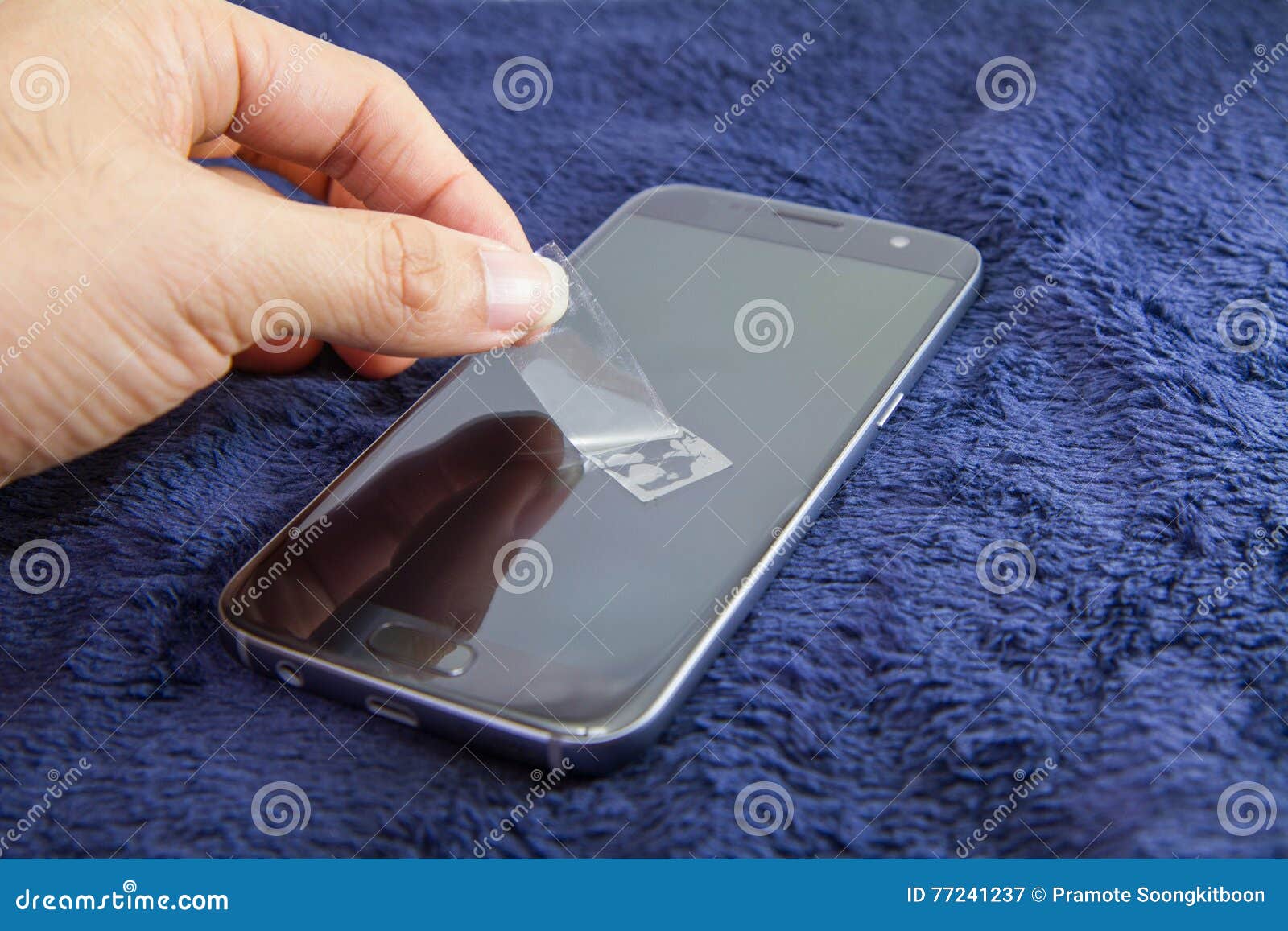 Cleaning Mobile Phone Screen by Adhesive Clear Tape. Stock Image ...