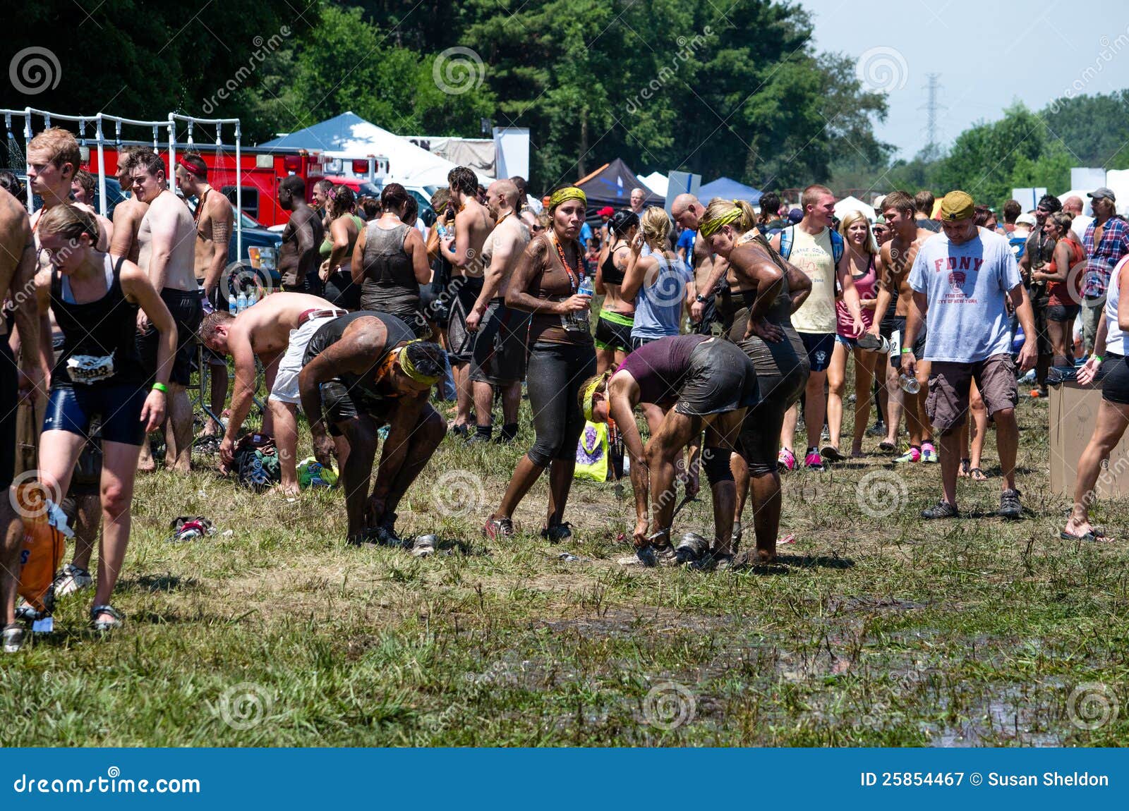 Cleaning off the mud editorial photography. Image of mess - 25854467