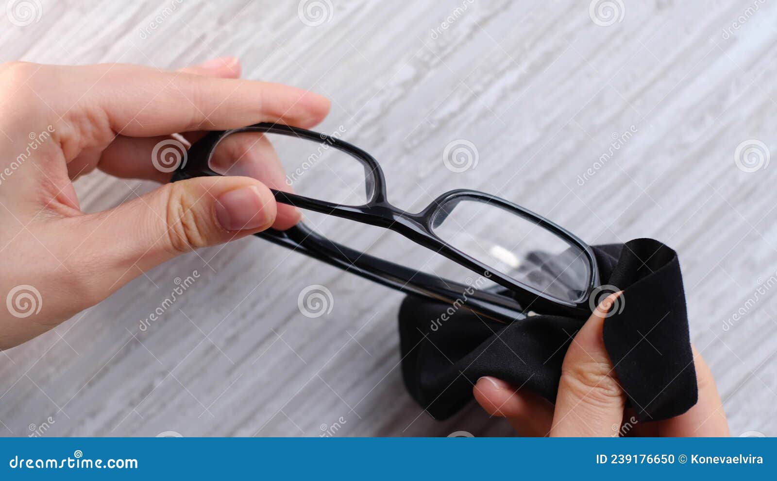 Cleaning a Pair of Dirty Eye Glasses with a Microfiber. Stock Photo ...