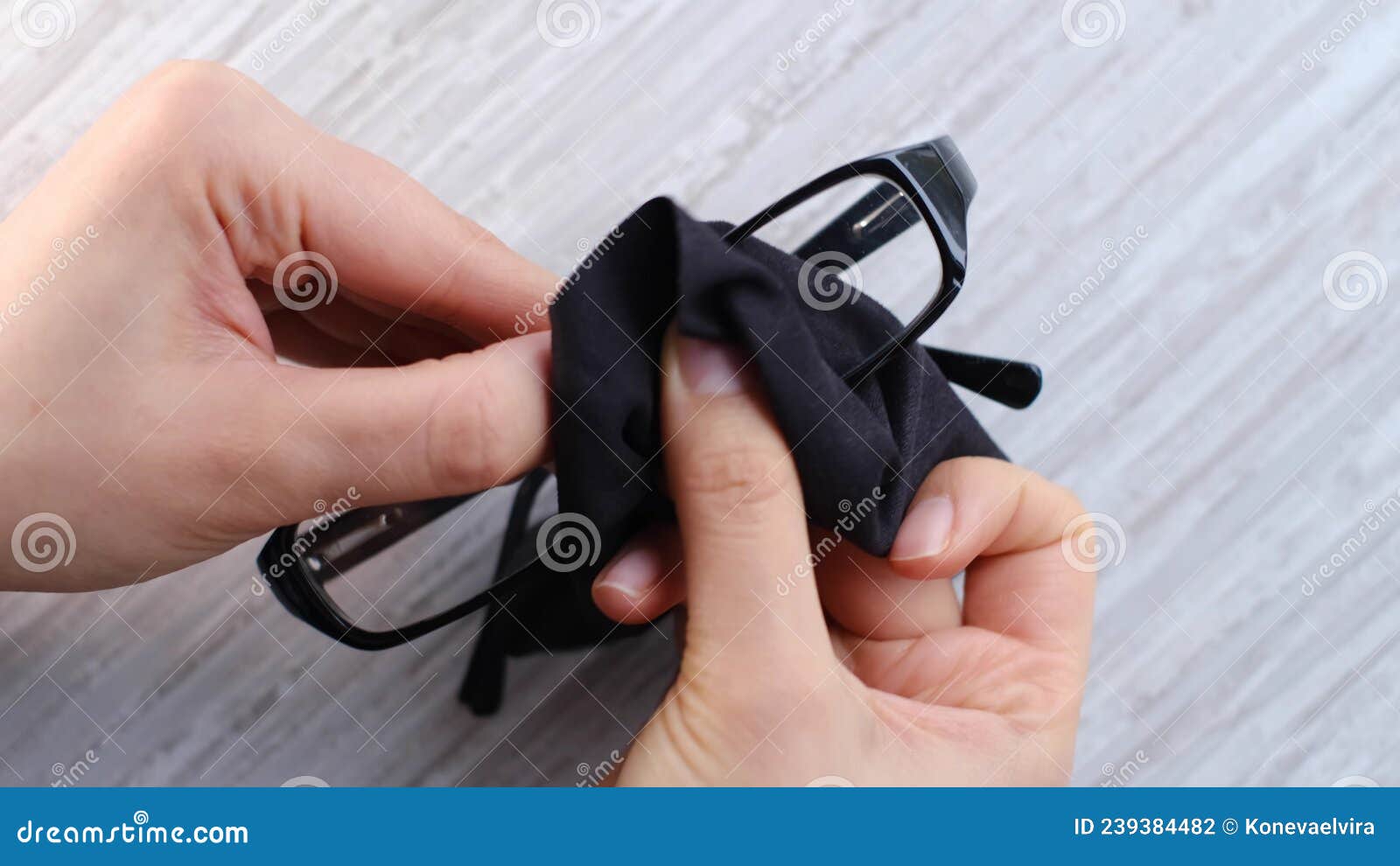 Cleaning a Pair of Dirty Eye Glasses with a Microfiber. Stock Photo ...