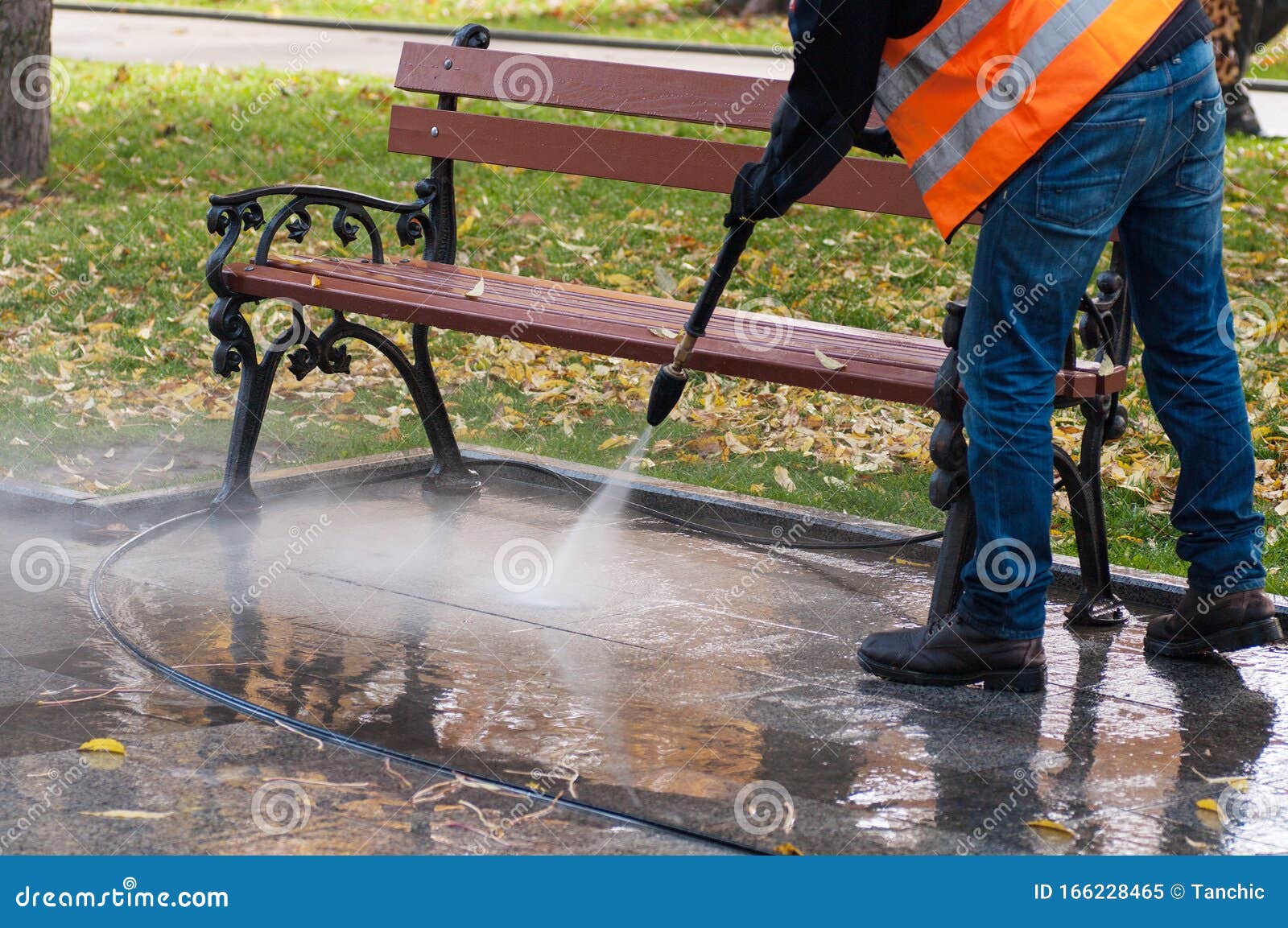 Cleaning the Park with Water in Autumn. a Worker Cleans the Park Stock ...