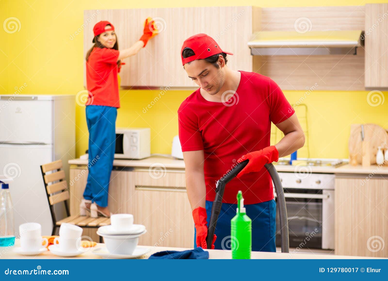 The Cleaning Professional Contractors Working at Kitchen Stock Image ...