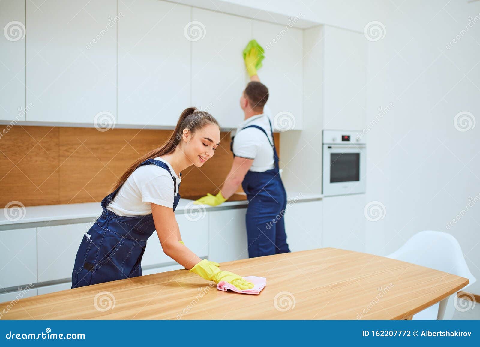 Cleaning Service Team at Work in Kitchen with White Interior Stock ...