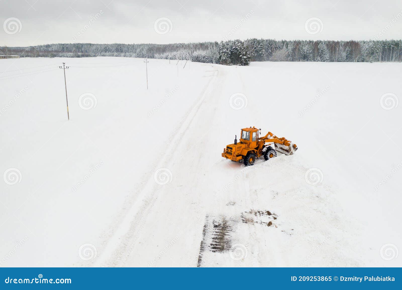 Cleaning Snow from the Streets after a Heavy Snowfall. Tractor Cleans ...