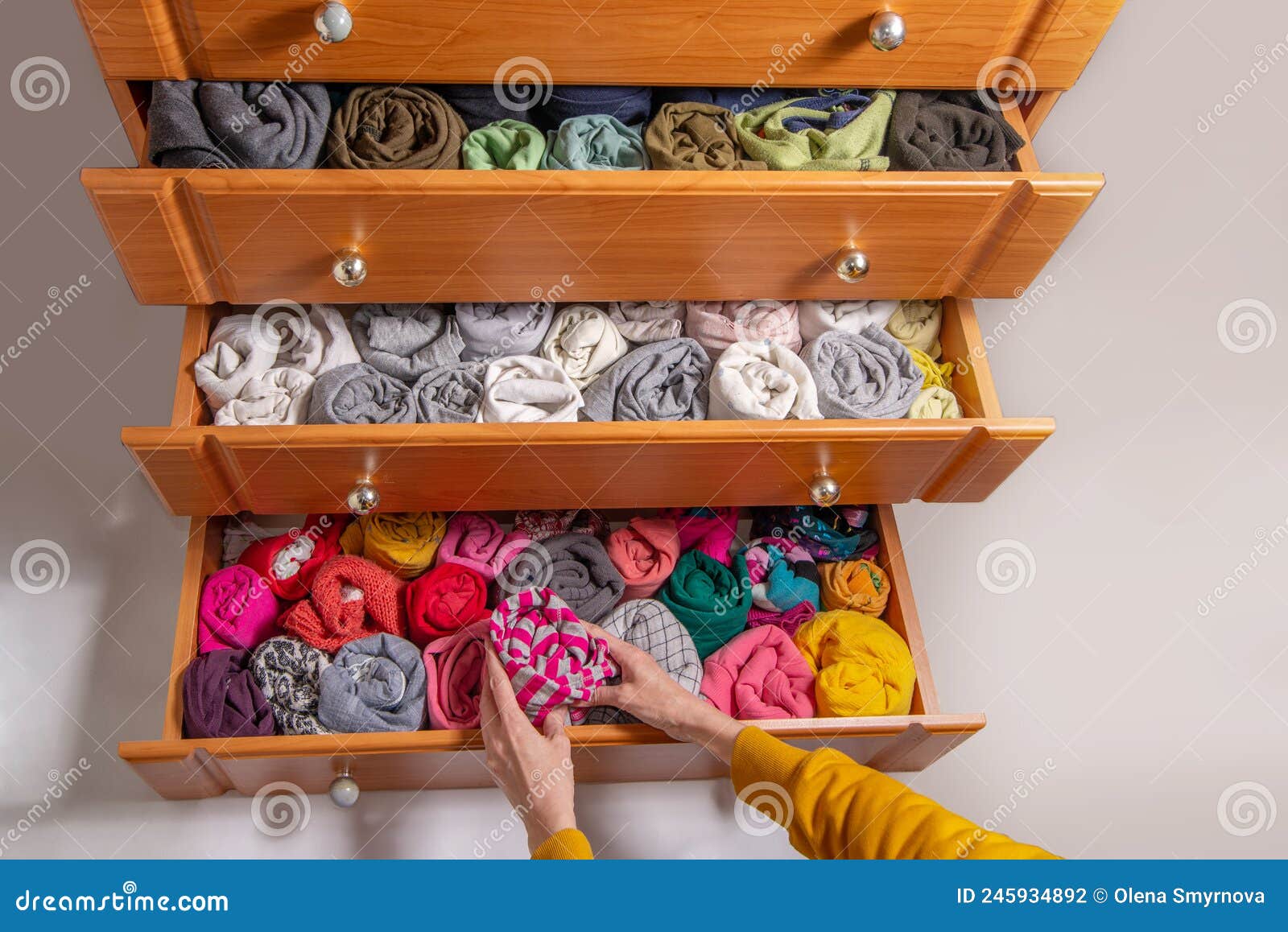 Open Chest Drawers with Vertical Storaged Twisting Clothes. Stock Photo ...