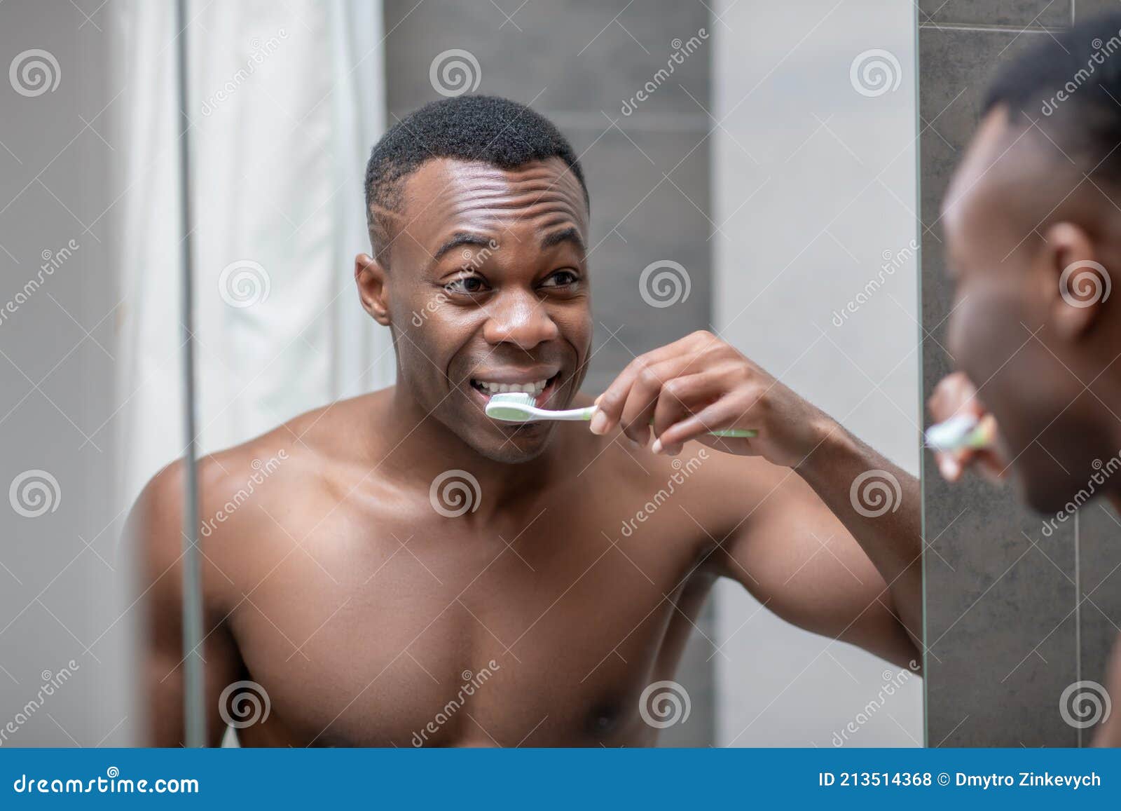 African American Young Handsome Man Cleaning His Teeth Stock Photo ...