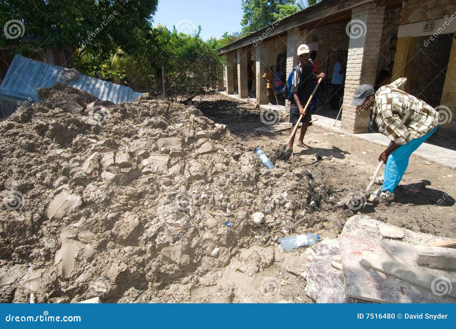 Cleaning Up the Aftermath editorial image. Image of tropical - 7516480