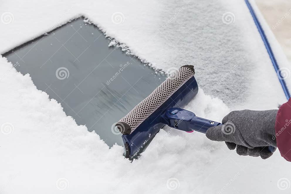 Cleaning Windshield from Snow with Scraper Stock Photo - Image of ...