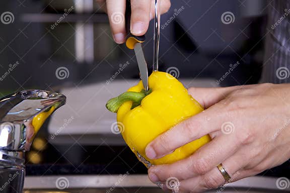 Cleaning a Yellow pepper stock image. Image of housewife - 10244653