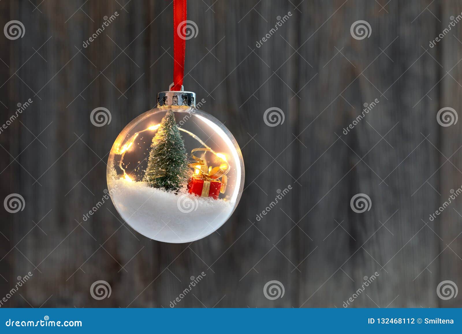 Clear Ball Ornament with Christmas Tree and Small Gift Stock Photo ...