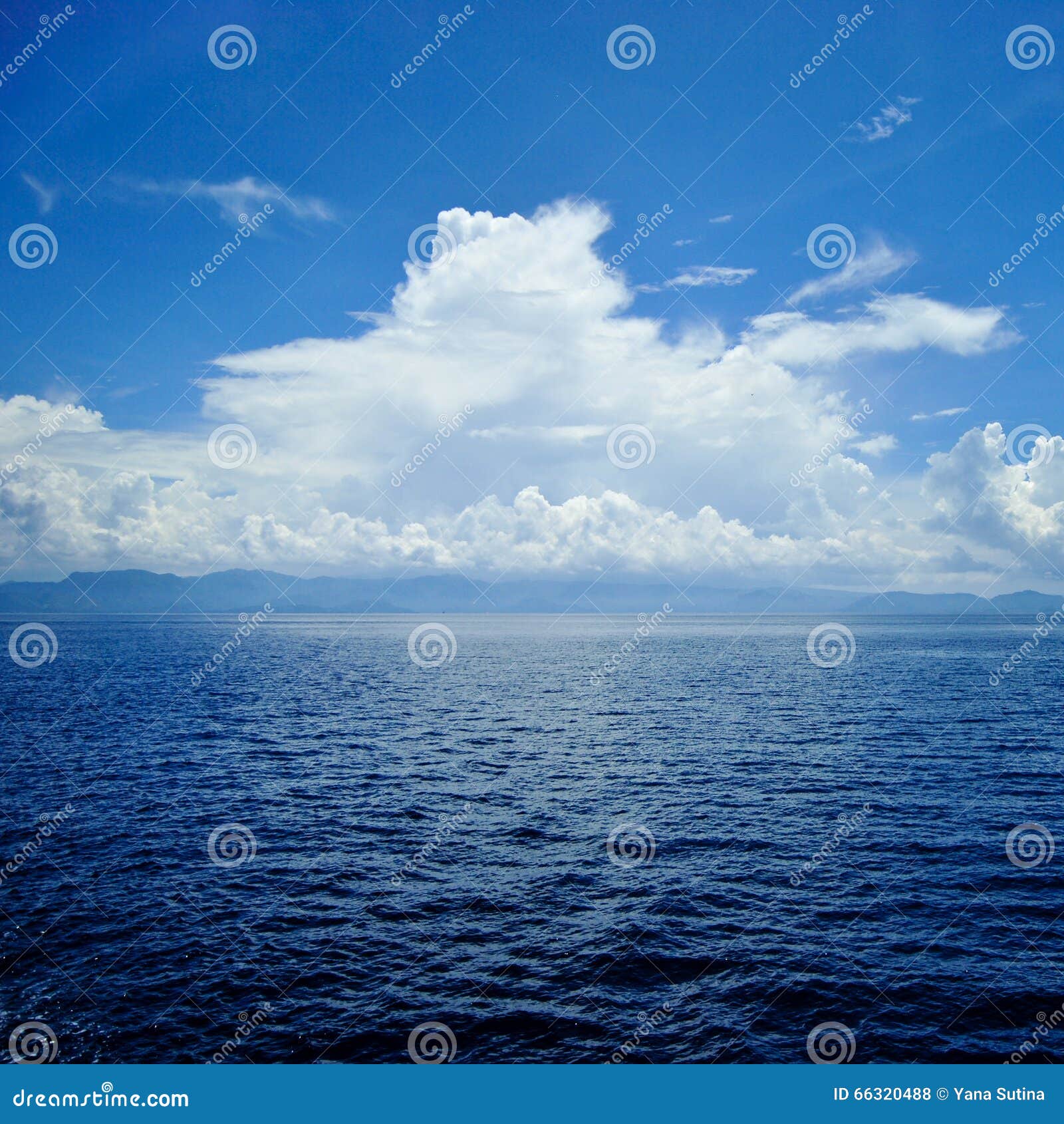 Clear Blue Sea Surface with Ripples and Sky with Clouds Over it Stock ...