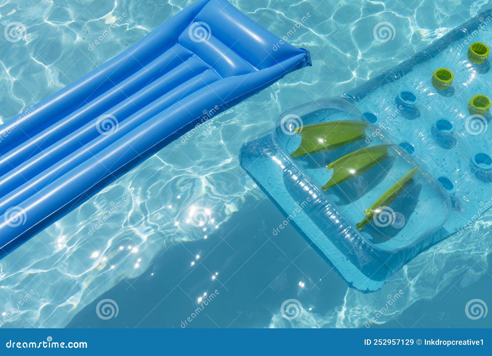 Clear Blue Summer Pool Lounger Float on a Rippled Swimming Pool Stock ...