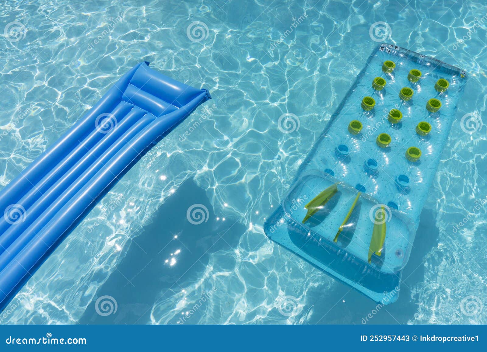 Clear Blue Summer Pool Lounger Float on a Rippled Swimming Pool Stock ...