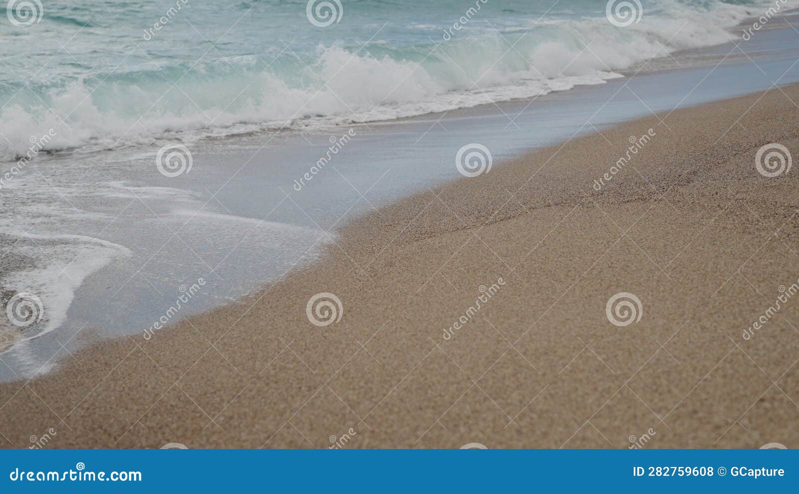 Clear Blue Waves with Strong Wind on a Sandy Empty Beach in Cannes in ...