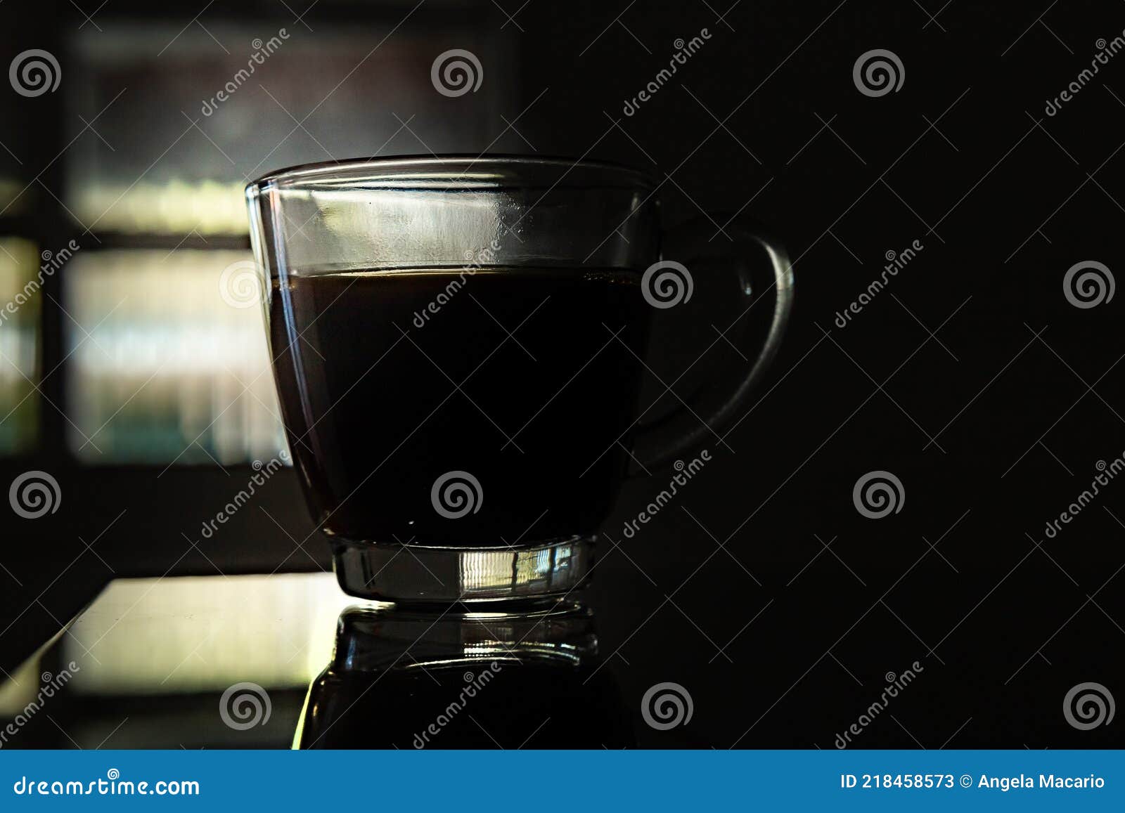 A Clear Glass Cup with Coffee on a Reflective Surface. Stock Image ...