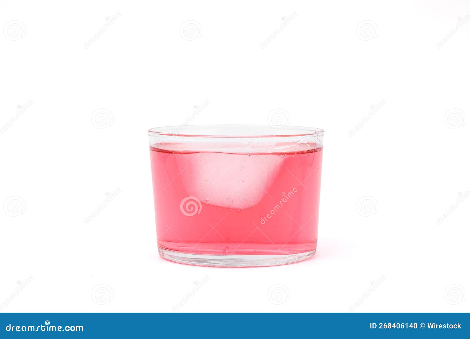 Clear Glass Filled with Pink Liquid on Top of a Table Stock Photo ...