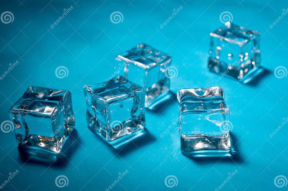 Clear Ice Cubes for Cooling Drinks on a Blue Background Stock Photo ... Clear Ice Cubes for Cooling Drinks on a Blue Background Stock Photo ...
